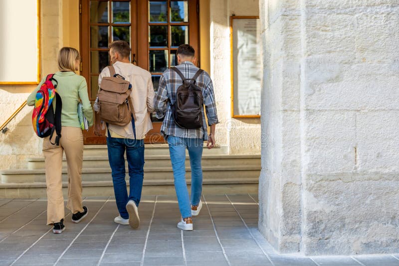 Students Students Walking Backwards To Camera after University Classes ...