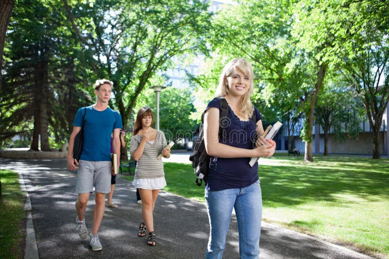 Students Walking on Campus stock image. Image of beautiful - 36406409