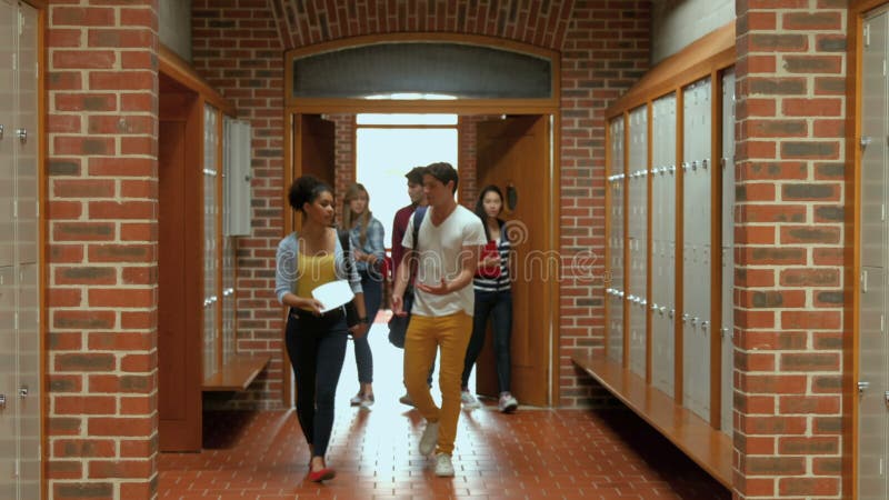 Students Walking Down Hallway To Locker Stock Footage - Video of ...