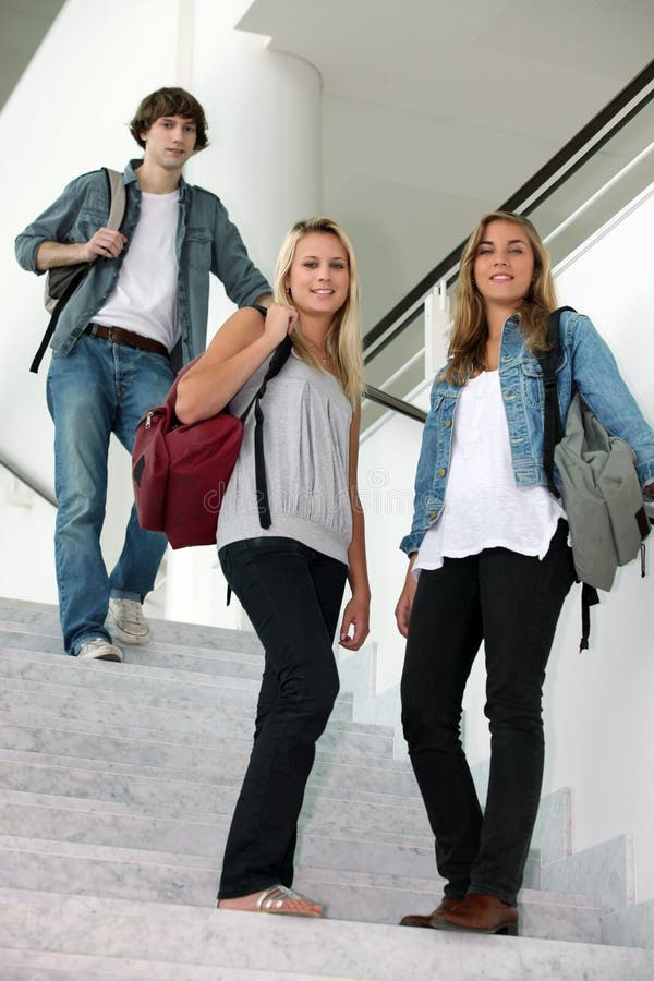 Three Students Walking Down Stairs Stock Photo - Image of blond ...