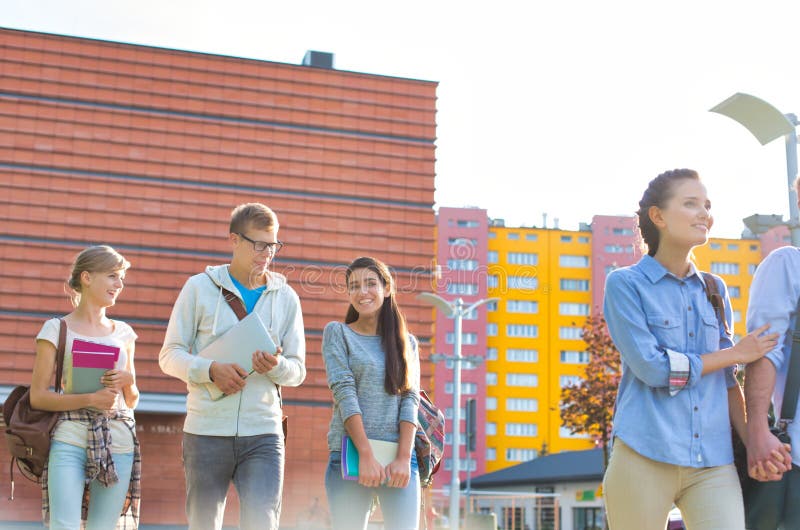 Students Walking Outside University Campus Stock Photo - Image of ...