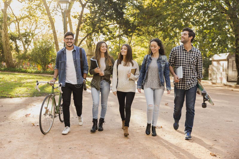 Students walking together stock photo. Image of park - 190328812