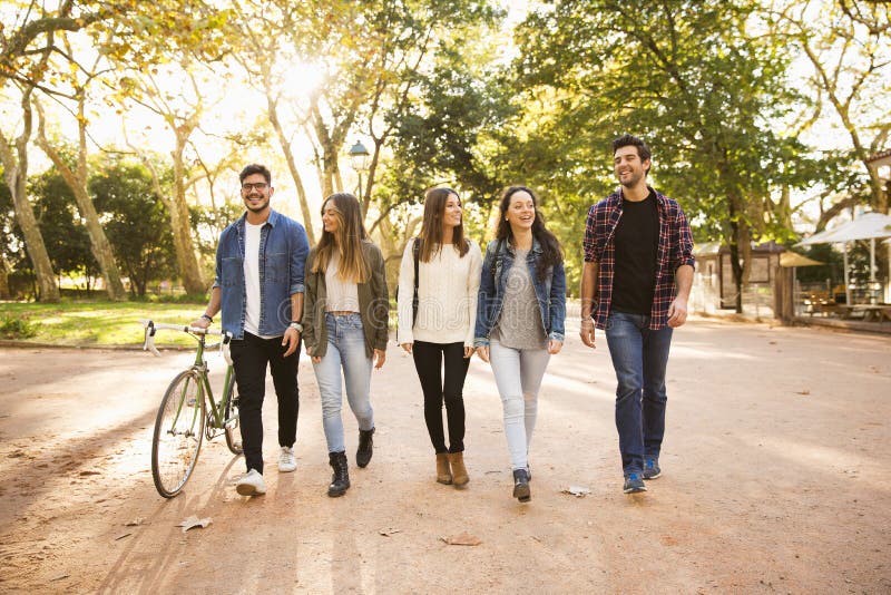Students walking together stock image. Image of outside - 221667013