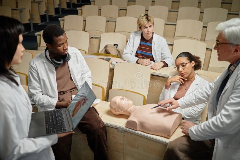 Students Watching Cpr Demonstration Dummy Stock Photos - Free & Royalty ...