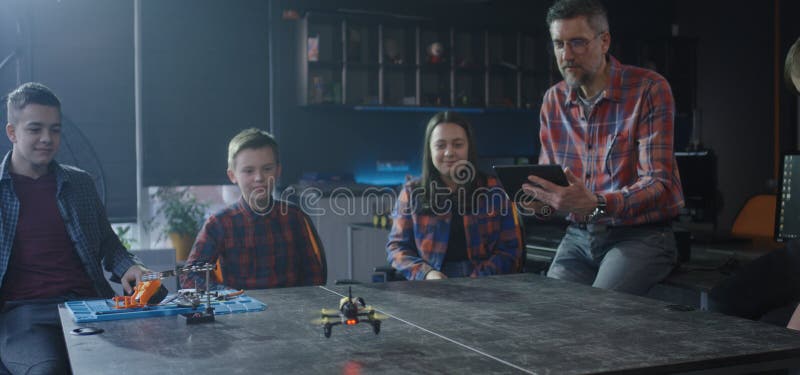 Students Watching Flying Drone in Class Stock Image - Image of robotics ...