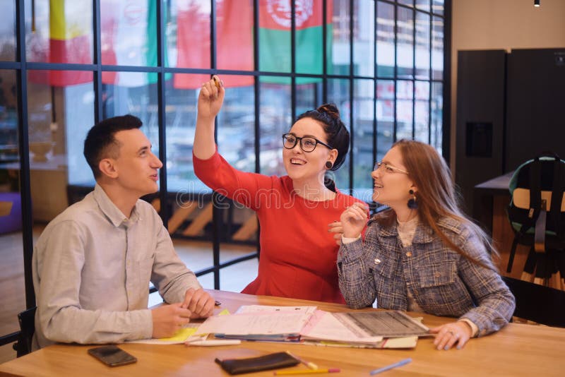 Students Work Together on a Project, Girls and a Guy Do Homework ...