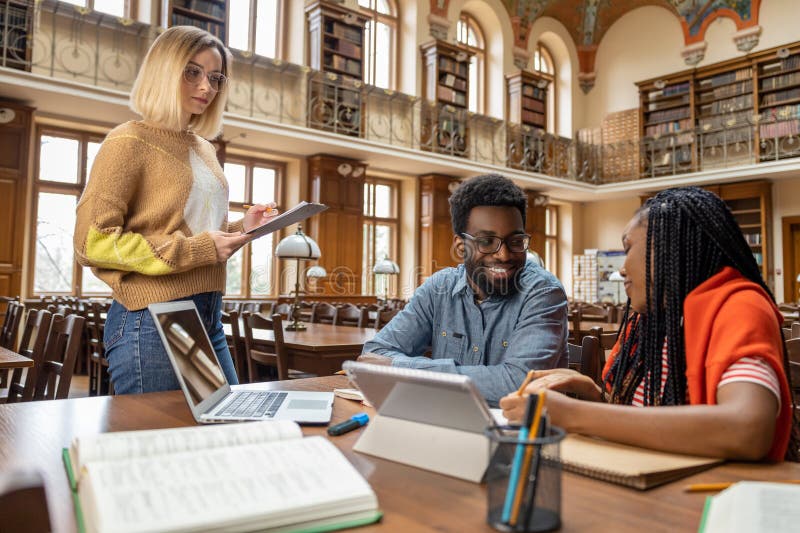 Students Work in University Library and Looking Involved Stock Photo ...