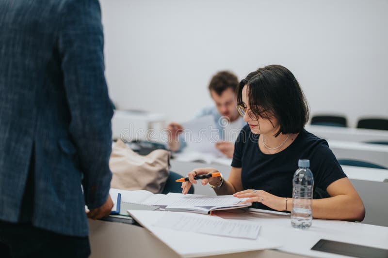 Students Working on Class Tasks with Professor Providing Guidance Stock ...