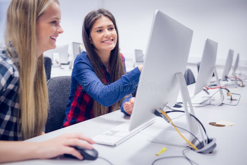 Two Students Working Together with Book and Laptop Stock Image - Image ...