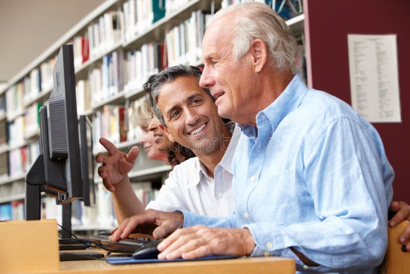 Students Working on Computers in Library Stock Image - Image of adult ...