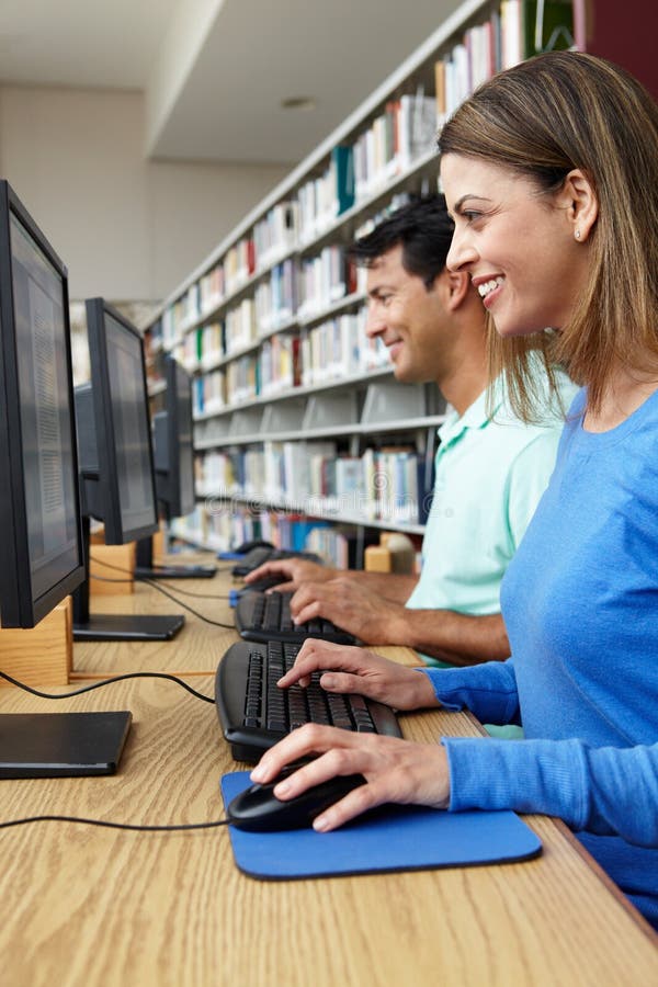 Students Working on Computers in Library Stock Photo - Image of ...