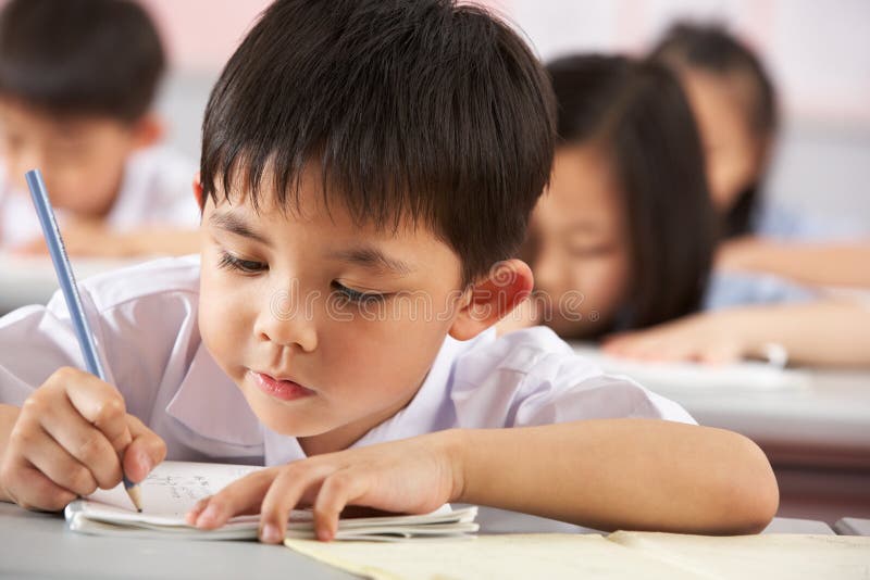Students Working at Desks in Chinese School Stock Photo - Image of ...