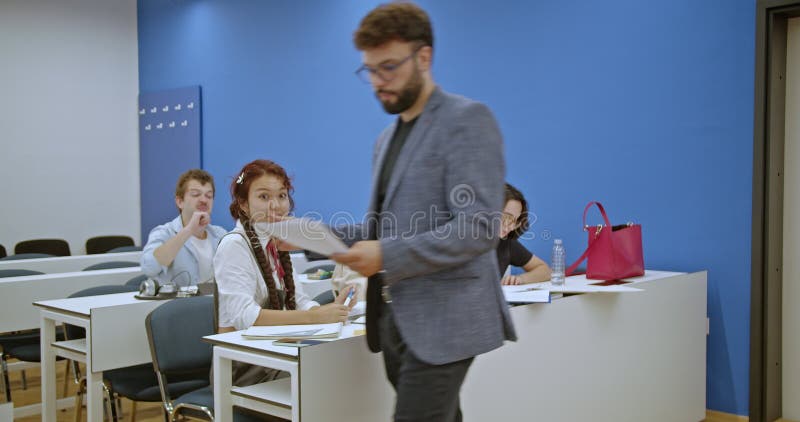 Students Working on Individual Tasks or Exam during Class. Professor ...