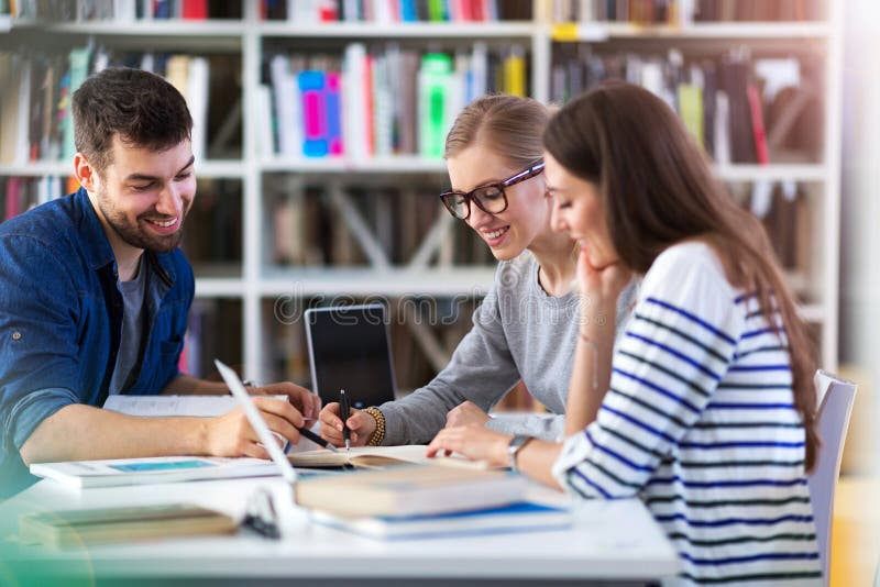 Students Working in the Library at Campus Stock Photo - Image of ...