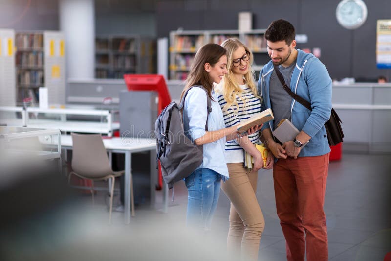 Students Working in the Library at Campus Stock Photo - Image of ...