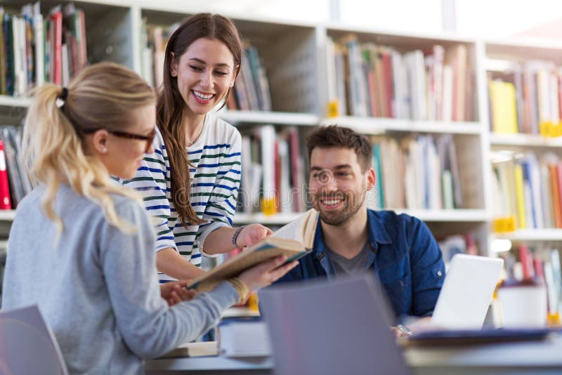 Students Working in the Library at Campus Stock Photo - Image of ...