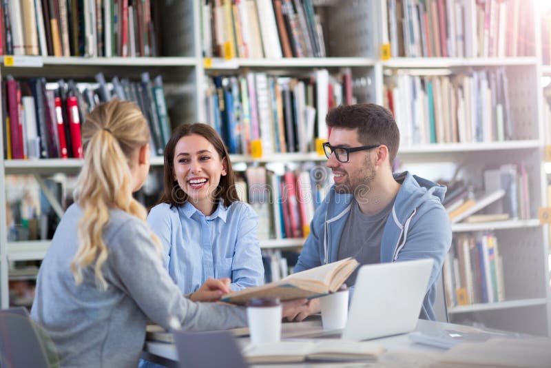 Students Working in the Library at Campus Stock Image - Image of happy ...