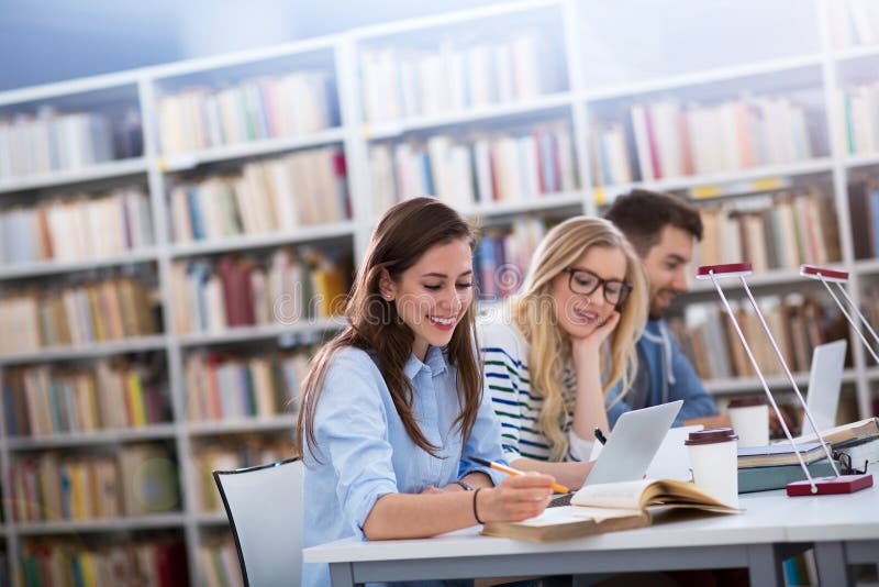 Students Working in the Library at Campus Stock Photo - Image of book ...