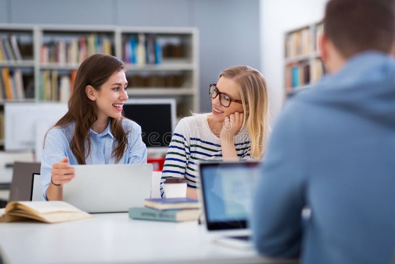 Students Working in the Library at Campus Stock Photo - Image of ...