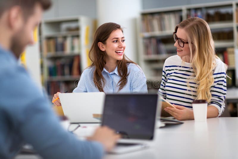 Students Working in the Library at Campus Stock Photo - Image of ...