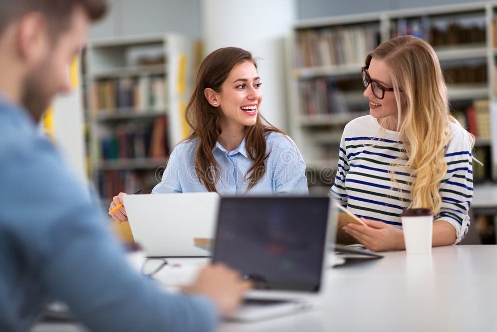 Students Working in the Library at Campus Stock Photo - Image of ...