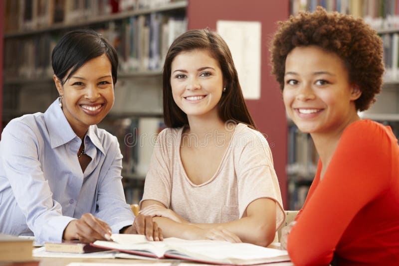2 Students Working in Library with Teacher Stock Image - Image of ...