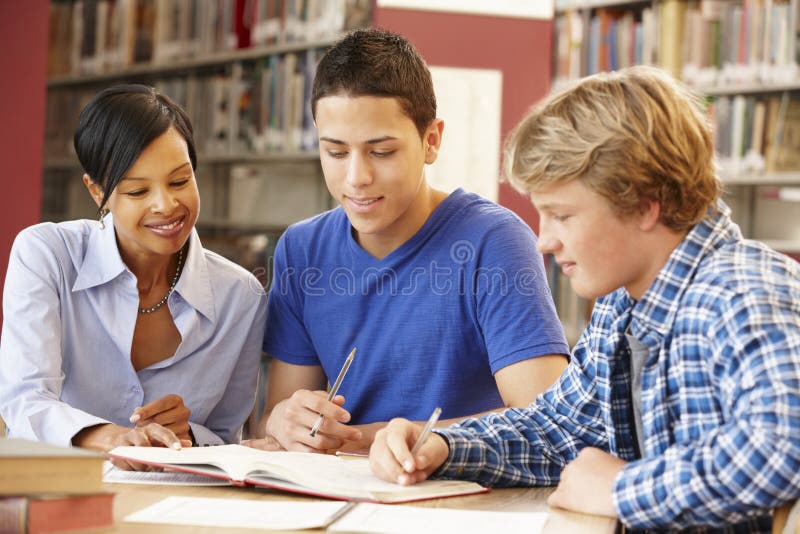 Working in the Library stock image. Image of cheeky, smile - 112583