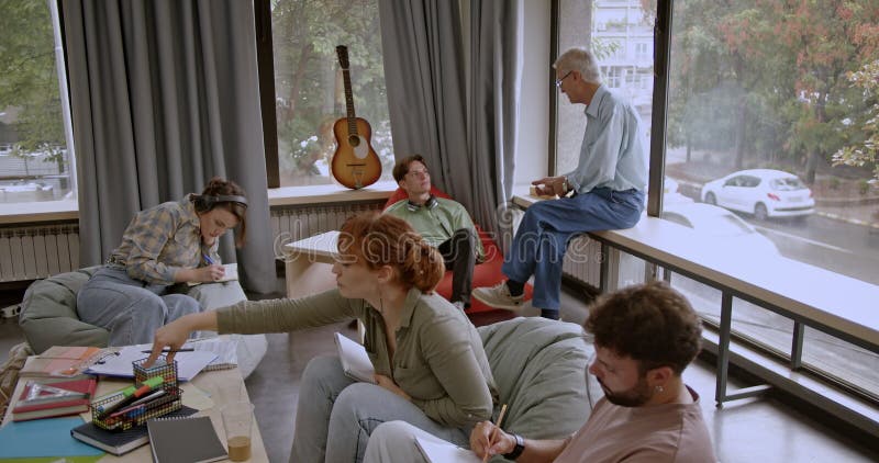 Students Working on School Project in Library. Friends and Classmates ...