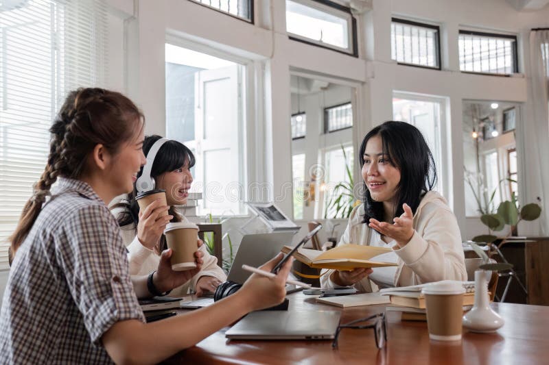 Diverse Group of Students Collaborating on Homework in a Modern Study ...