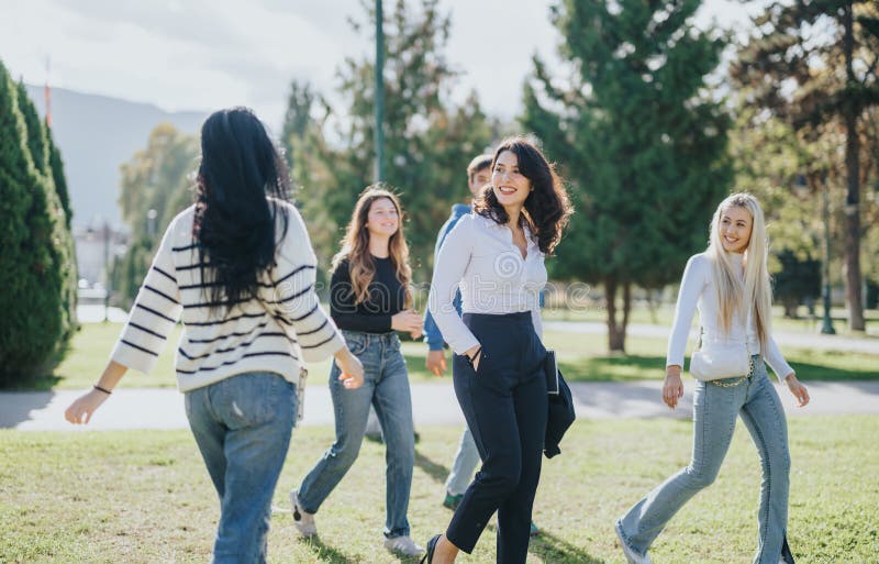Students Working Together in a Park, Discussing and Collaborating on a ...