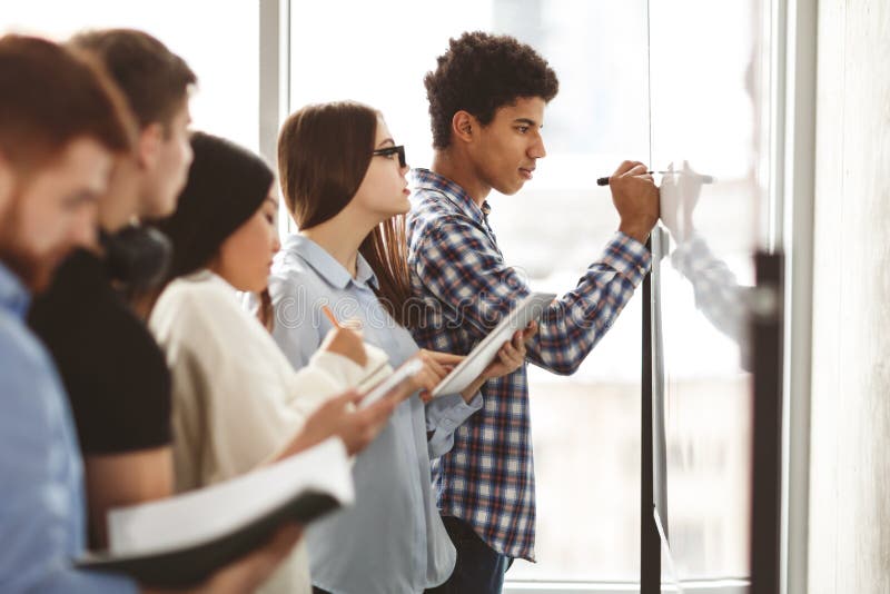 Students Writing Algebra Equations on Whiteboard in Classroom Stock ...