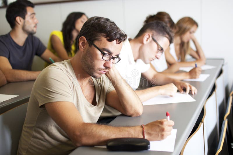 Students Writing an Exam in Class Room Stock Image - Image of people ...