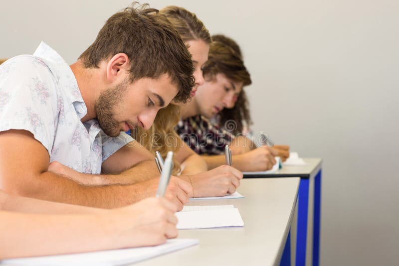 Students Writing Notes in Classroom Stock Photo - Image of knowledge ...