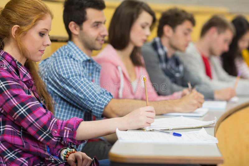 Students Writing Notes in a Row at Lecture Hall Stock Image - Image of ...