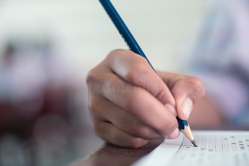 Students Writing Pen in Hand Doing Exams Answer Sheets Exercises in ...