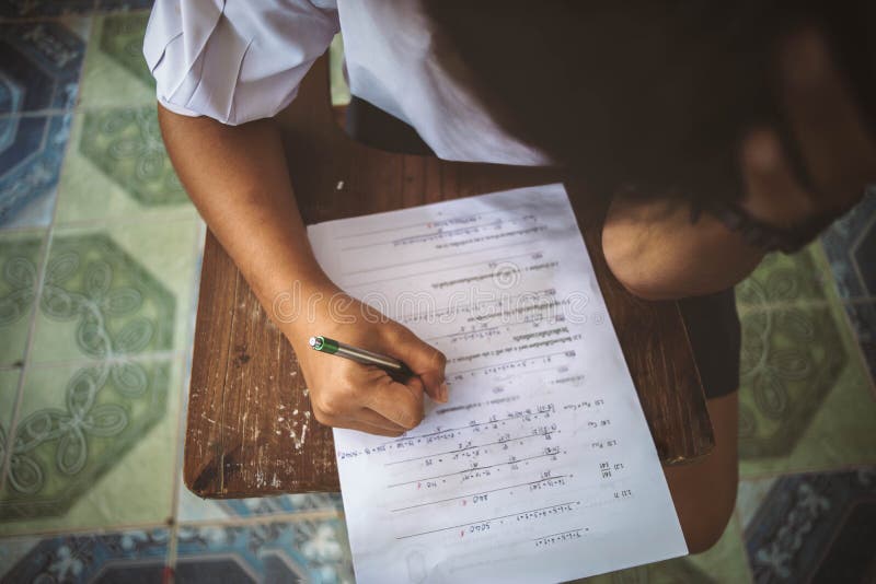Students Writing Pen in Hand Doing Exams Answer Sheets Exercises in ...
