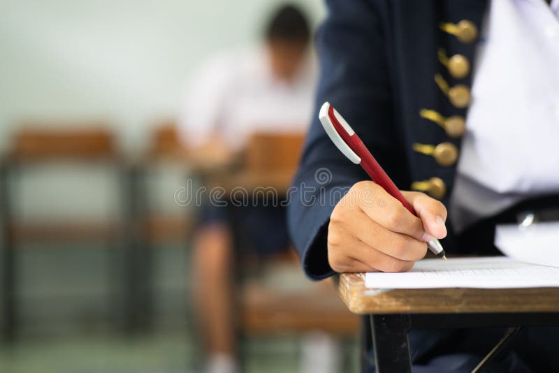 Students Writing and Reading Exam Answer Sheets Exercises in Classroom ...