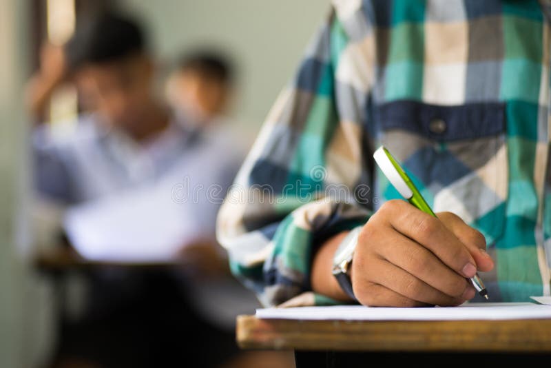 Students Writing and Reading Exam Answer Sheets Exercises in Classroom ...