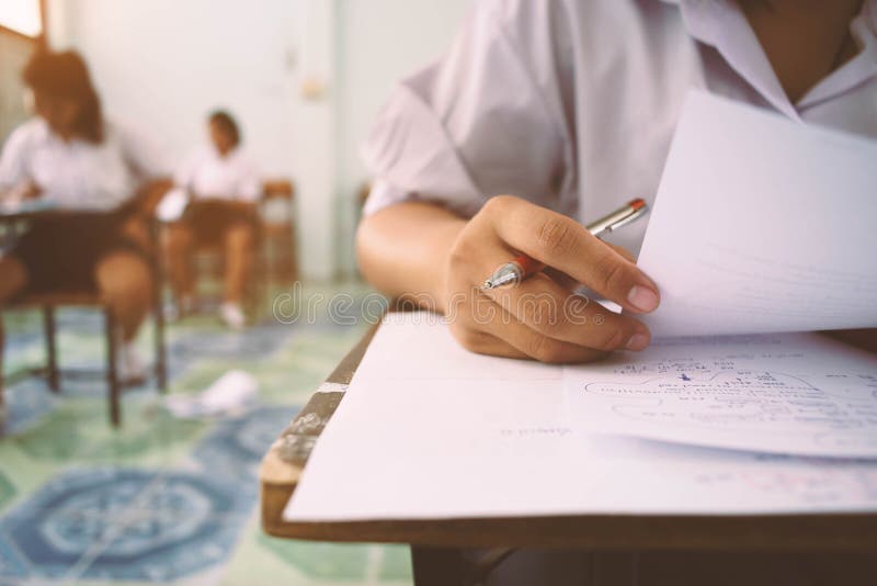 Students Writing and Reading Exam Answer Sheets Exercises in Classroom ...