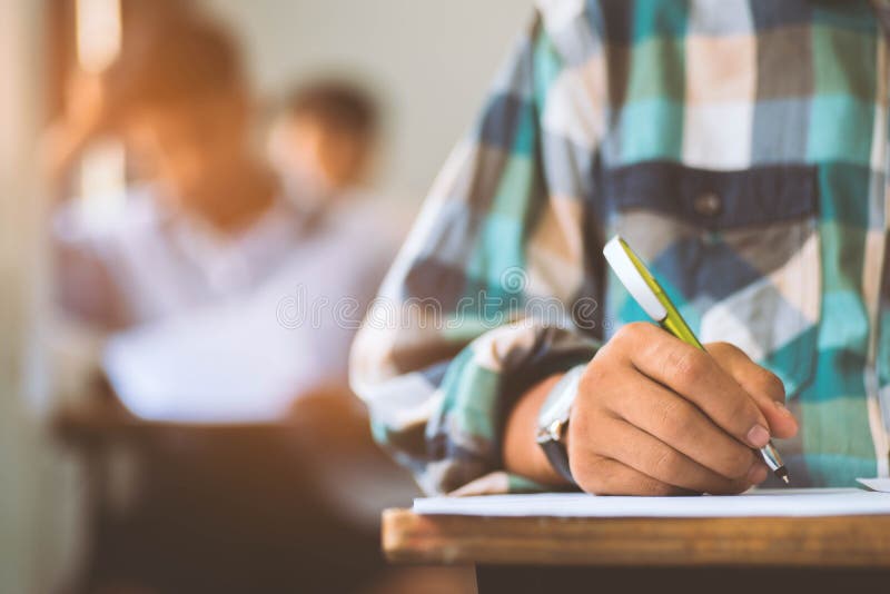 Students Writing and Reading Exam Answer Sheets Exercises in Classroom ...