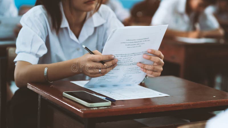 Students Writing and Reading Exam Answer Sheets Exercises in Classroom ...