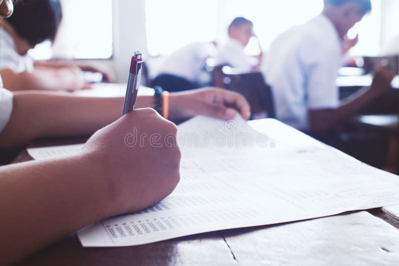 Students Writing and Taking Exam with Stress in Classroom Stock Photo ...