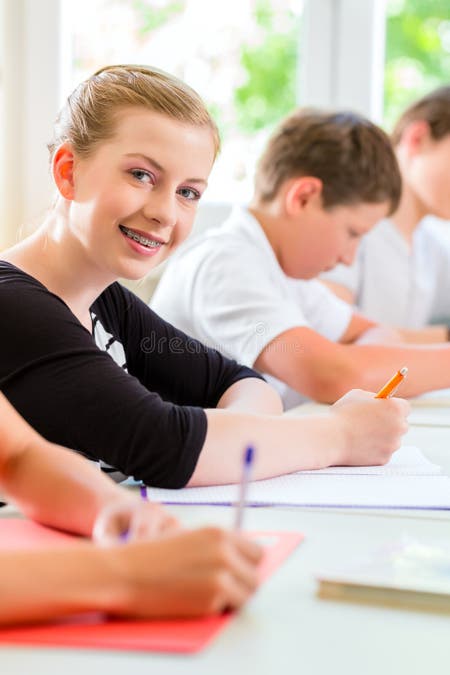 Students Writing a Test in School Concentrating Stock Photo - Image of ...