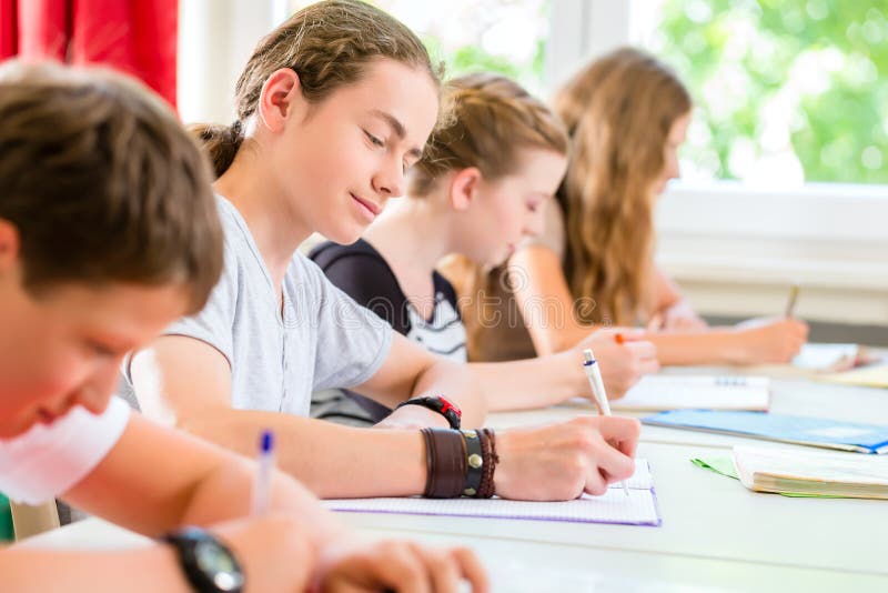 Students Writing a Test in School Concentrating Stock Photo - Image of ...
