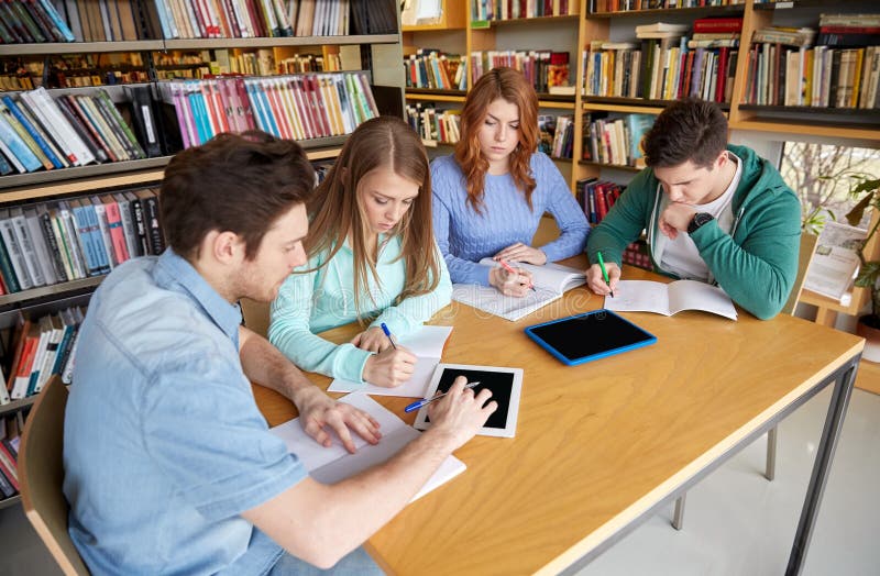 Students Writing To Notebooks in School Library Stock Image - Image of ...