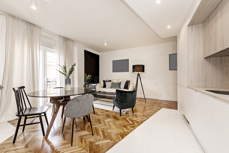 Studio Apartment with Open Plan Kitchen and Round Glass Dining Table ...