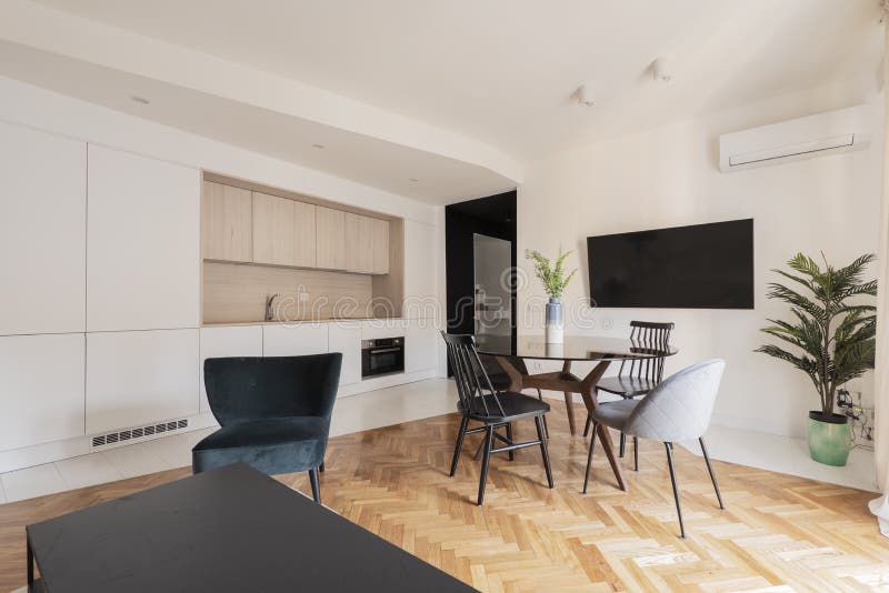 Studio Apartment with Open-plan Kitchen, Round Glass Dining Table and ...