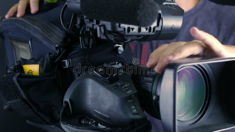 Studio Camera. Cameraman Changing Camera Settings Focal Length ...