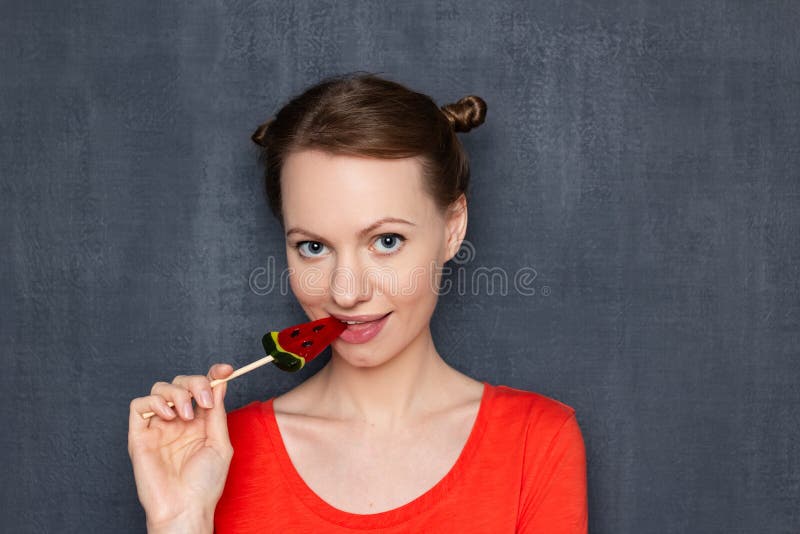 Portrait of Cute Flirty Young Biting Lollipop and Smiling Stock Image ... Portrait of Cute Flirty Young Biting Lollipop and Smiling Stock Image ...