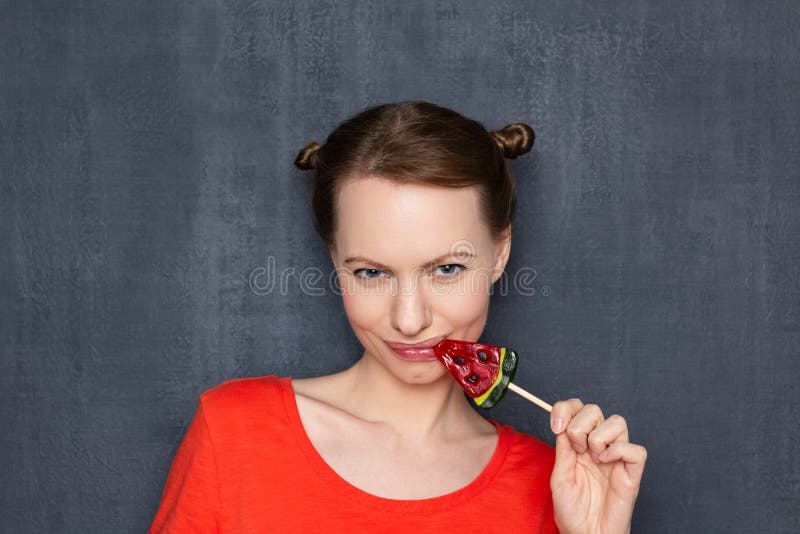 Portrait of Cute Flirty Young Woman Biting Lollipop and Smiling Stock ... Portrait of Cute Flirty Young Woman Biting Lollipop and Smiling Stock ...